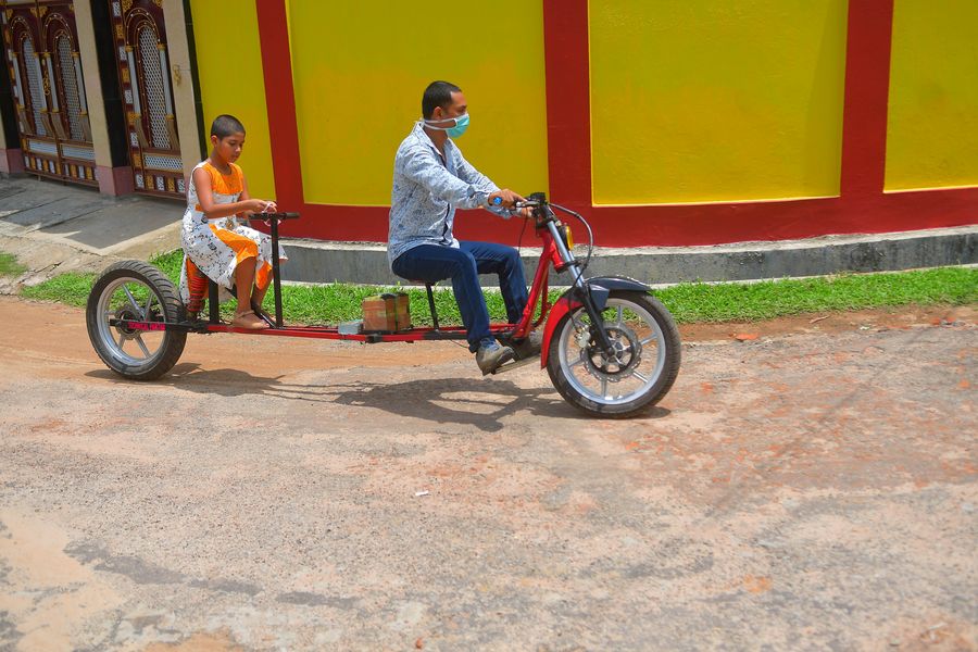 Social Distancing on Wheels: Indian Man Modifies Bike for Pandemic