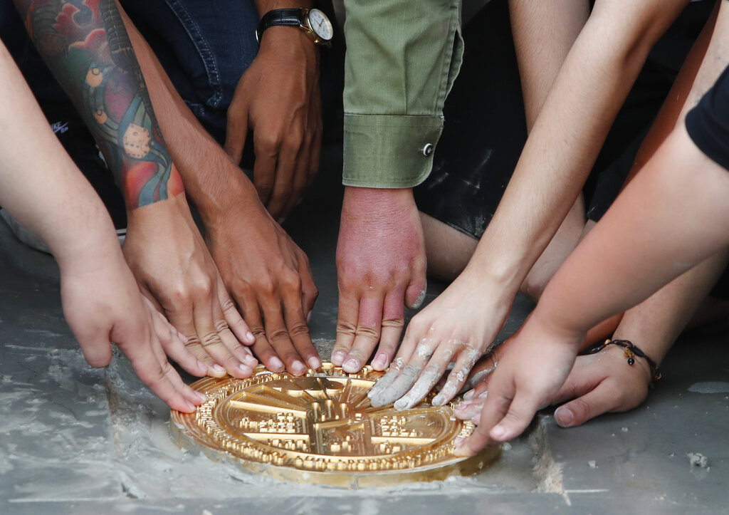 Protesters Reinstall Plaque Symbolizing Democracy