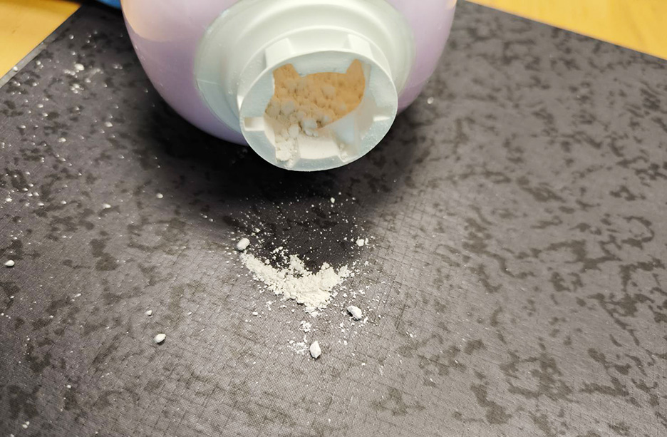 Chinese Man Caught with 3 kg of Heroin in Baby Powder Bottles