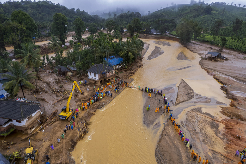 Rescuers Search Through Mud and Debris As Deaths Rise to 151 in ...