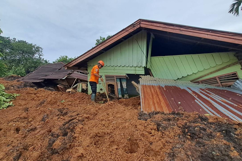 Indonesian Rescuers Search for Survivors as the Death Toll from Floods and Landslides Tops 300